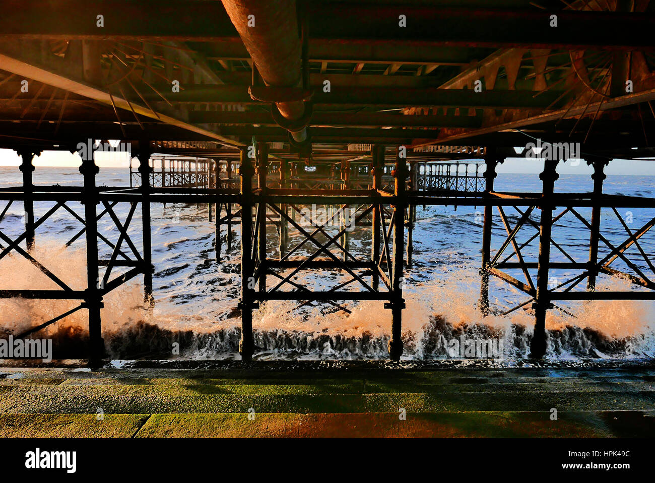 Waves breaking underneath south pier Blackpool Stock Photo - Alamy