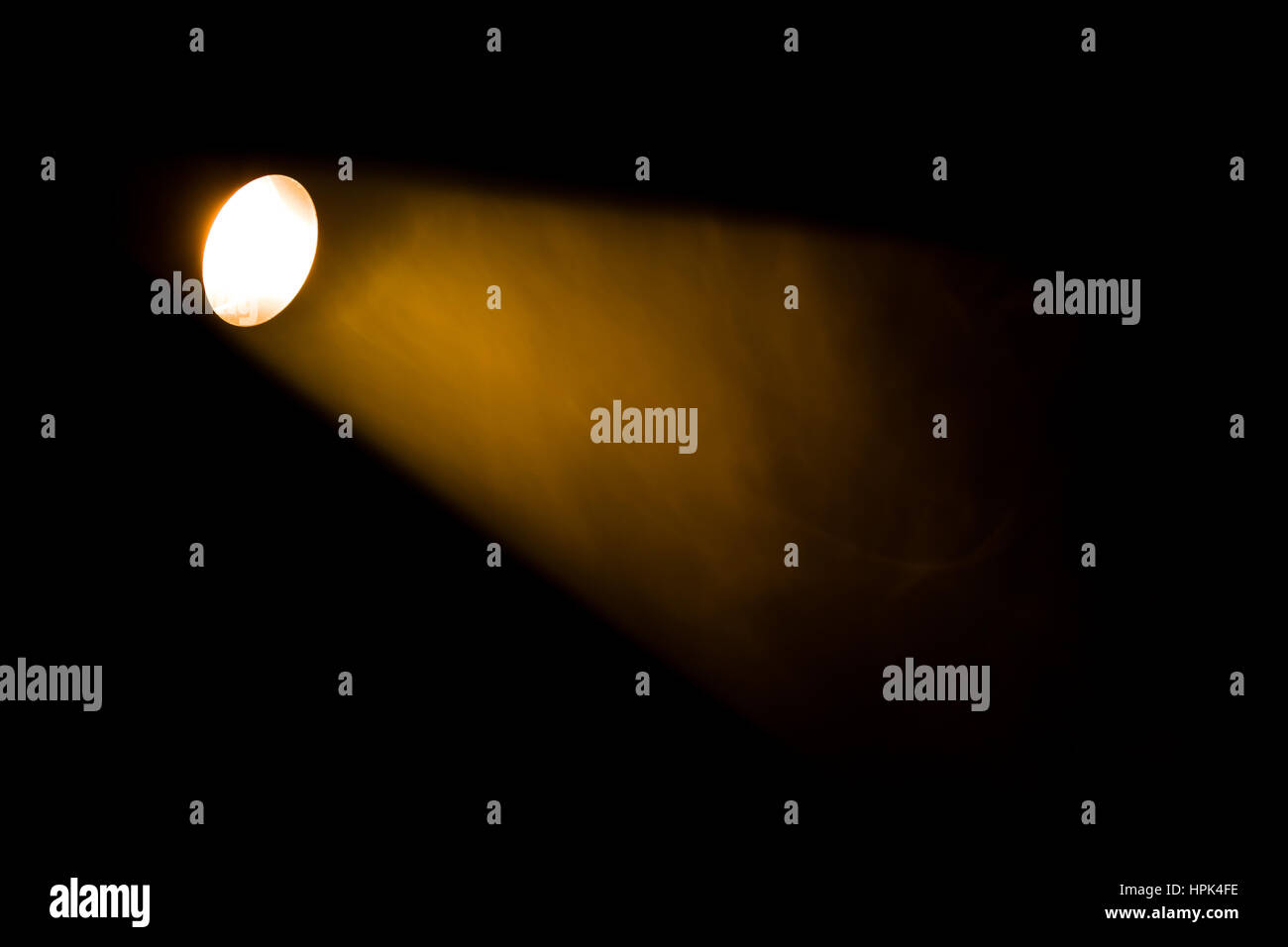 Authentic beam of light from reflector in theatre, smoke colored on ...