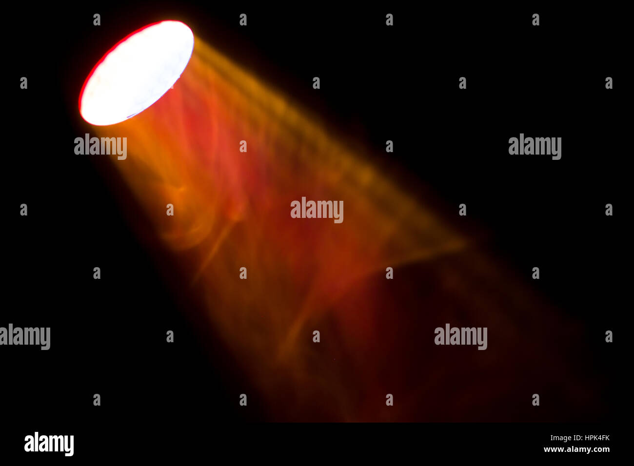 Authentic beam of light from reflector in theatre, smoke colored on ...