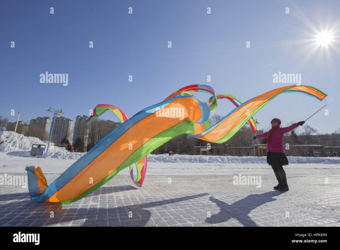 Jilin, China. 23rd Feb, 2017. Women wave colourful ribbons to celebrate ...