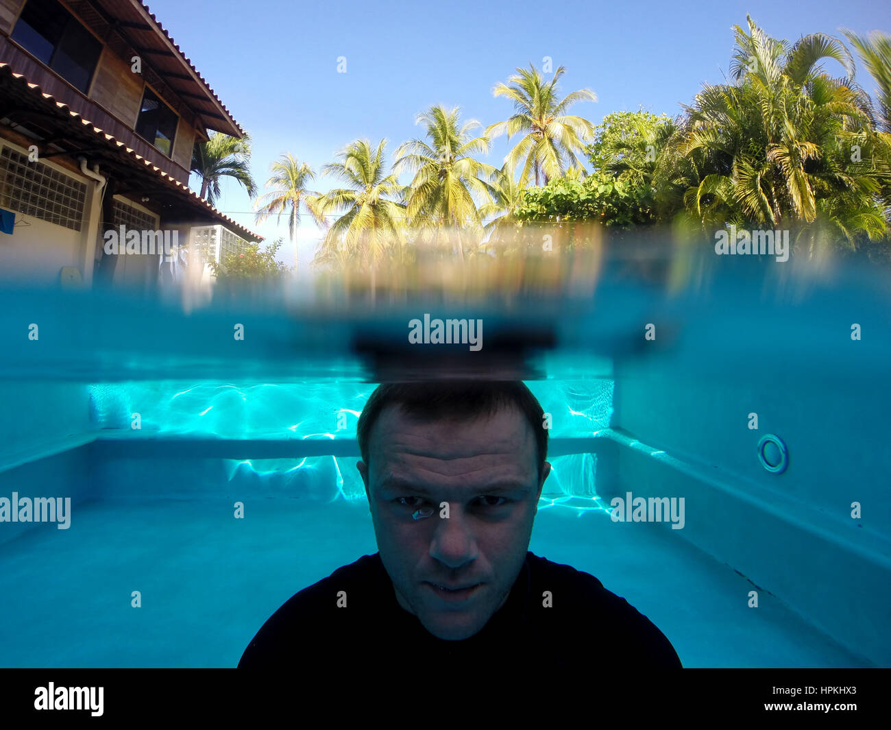 Man in swimming pool Stock Photo - Alamy