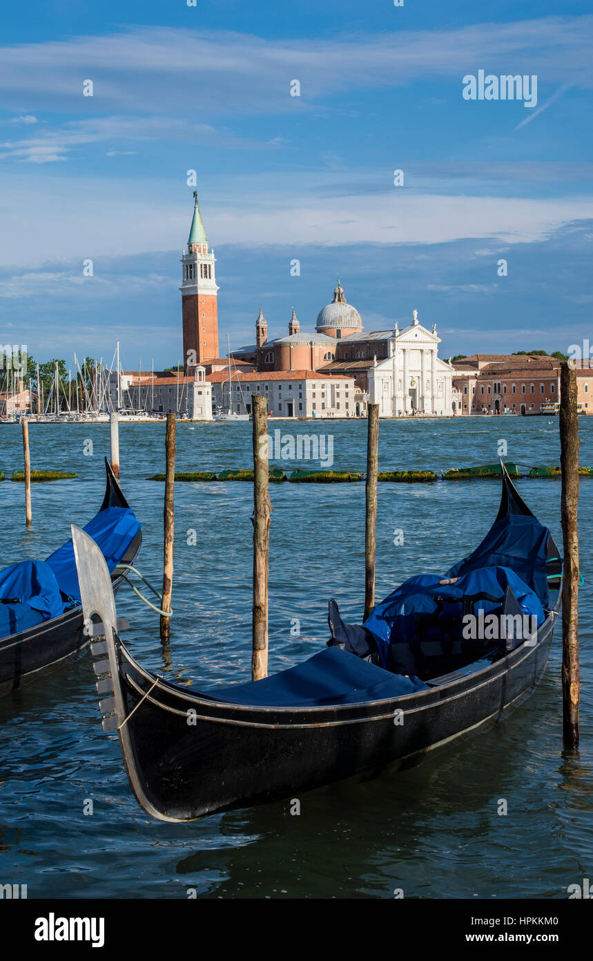 Saint George Basilica island in Venice lagoon with gondola Stock Photo ...