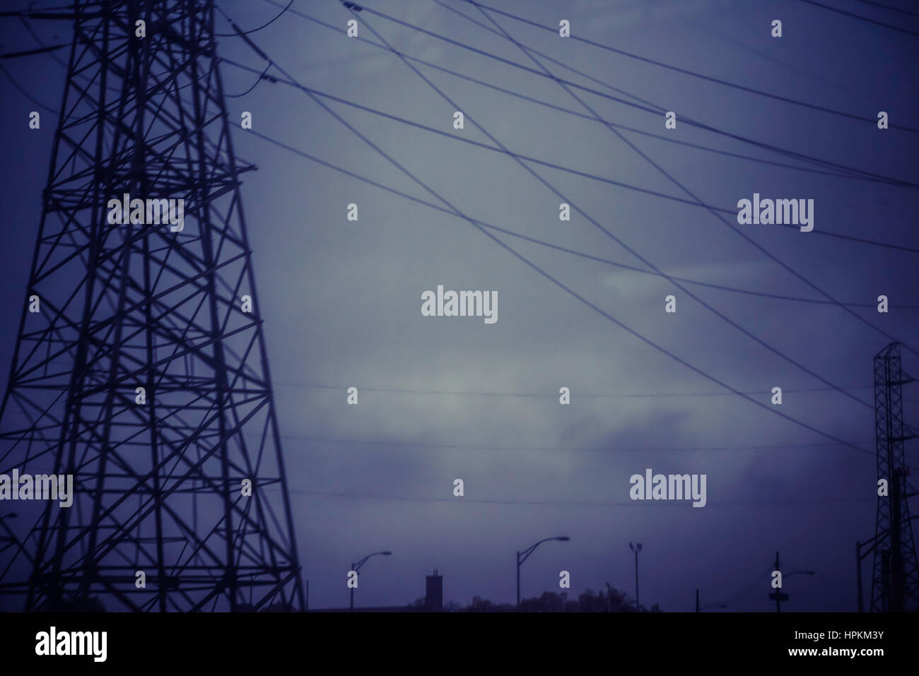 Industrial high tension power line towers Stock Photo - Alamy