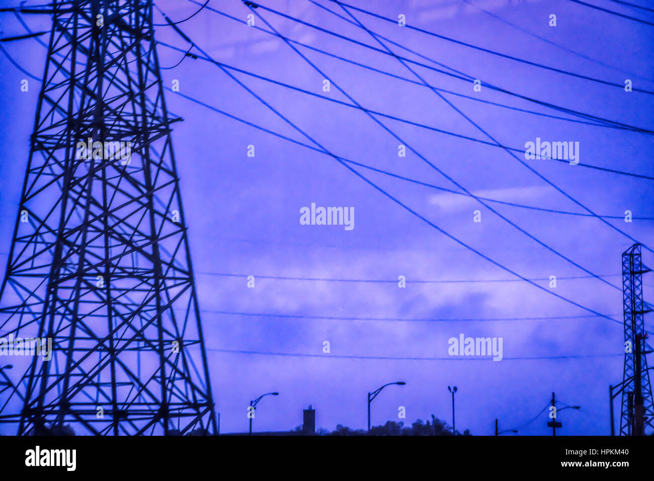 Industrial high tension power line towers Stock Photo - Alamy