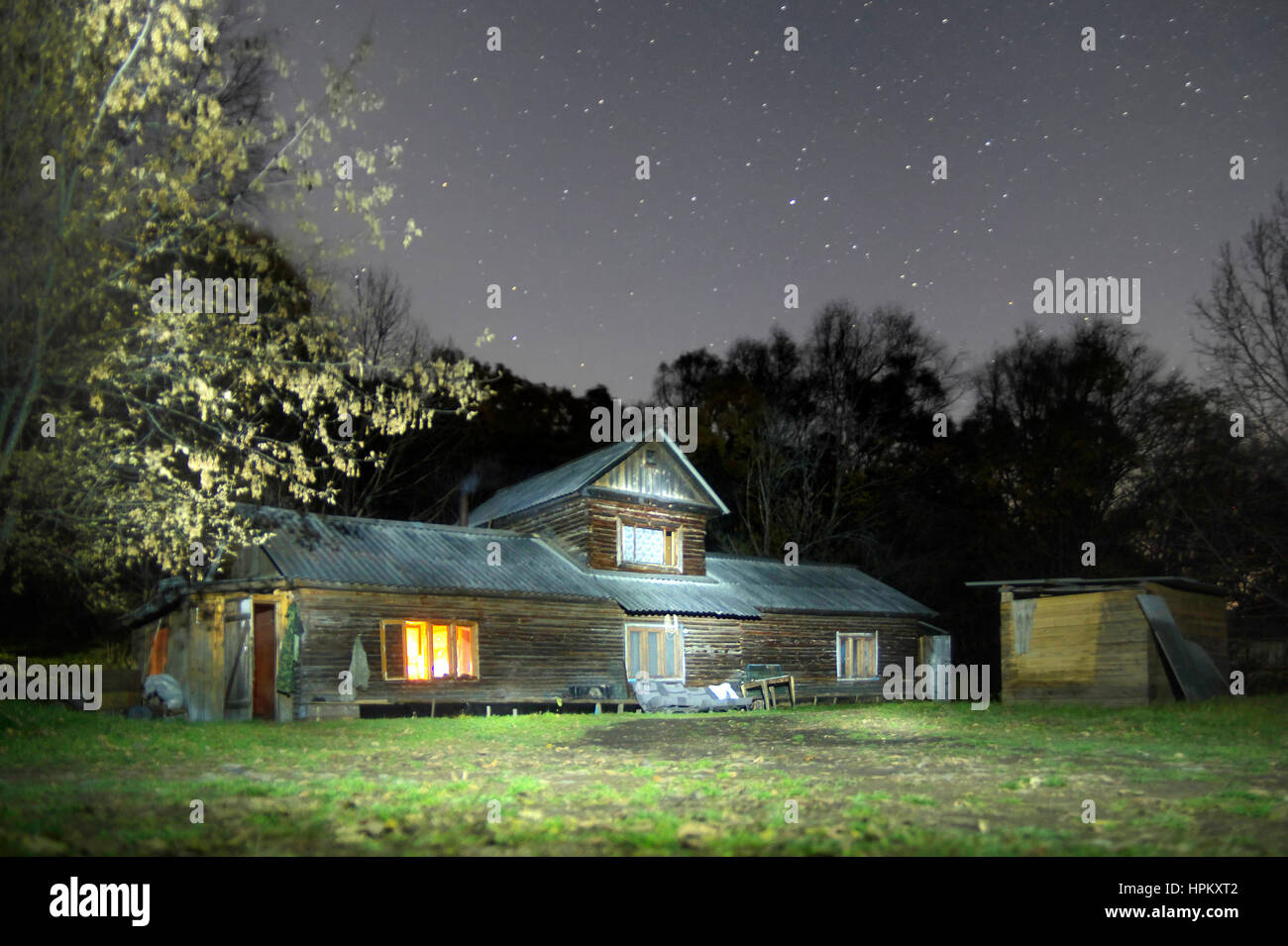night sky with stars and dramatic house Stock Photo - Alamy