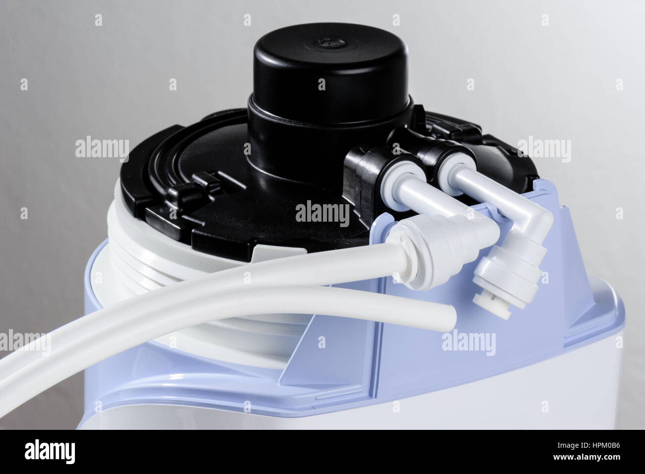 installing rubber tube to bracket of water purifier Stock Photo - Alamy