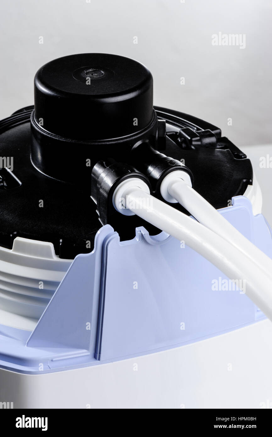 installing rubber tube to bracket of water purifier Stock Photo - Alamy
