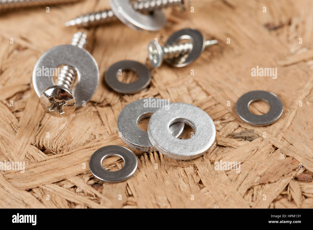 Closeup heap of screw and pad screw washer Stock Photo - Alamy