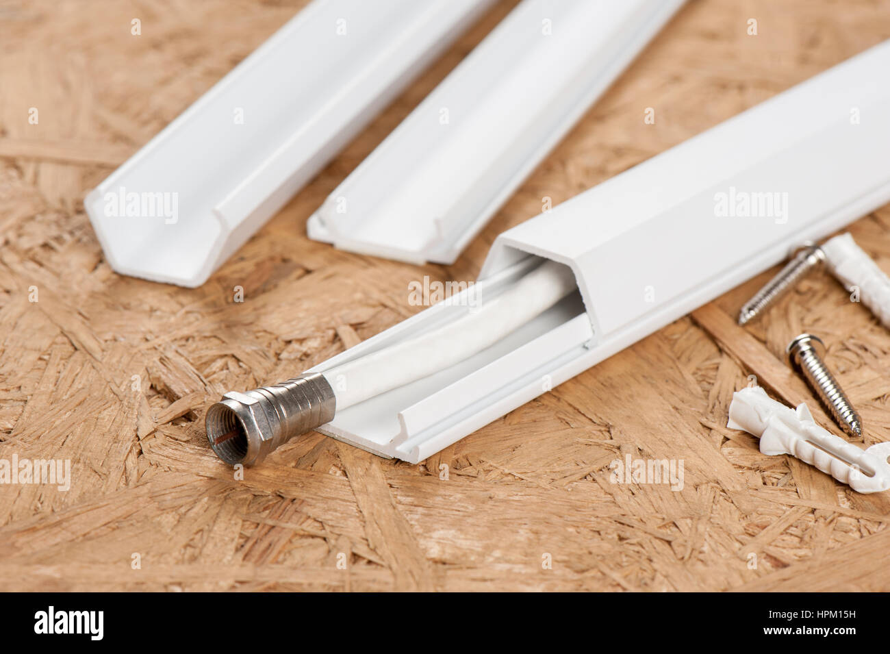easy install white plastic wiring duct Stock Photo - Alamy