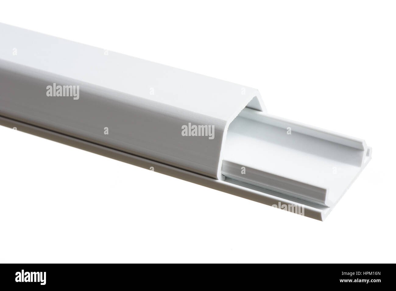 white plastic wiring duct isolated on white background Stock Photo - Alamy