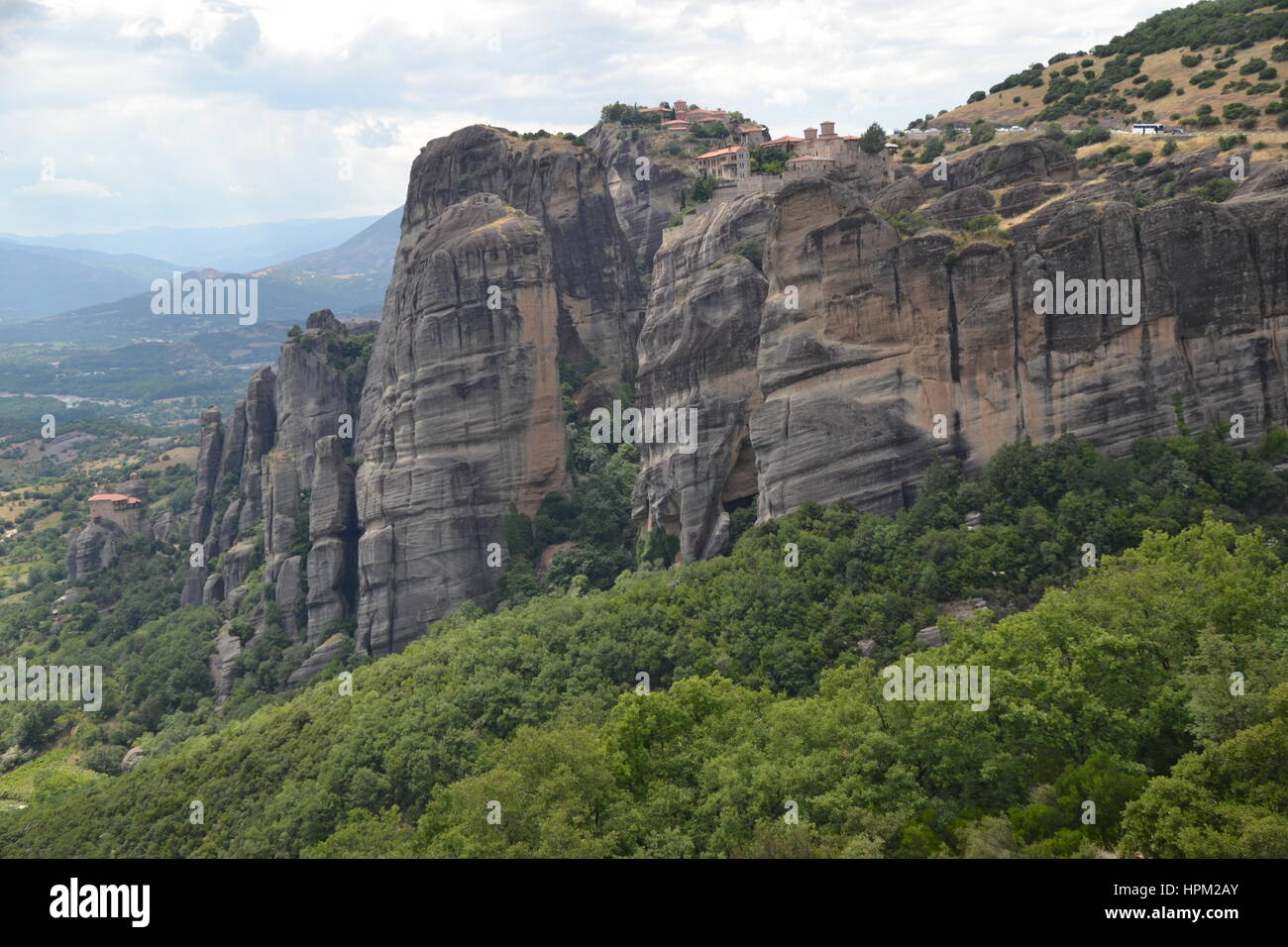 Meteora is formation of immense monolithic pillars and hills-like huge ...