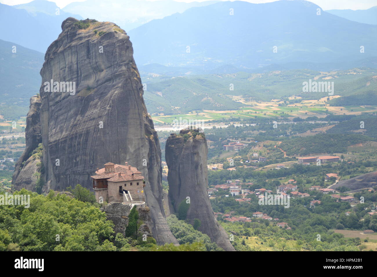 Meteora is formation of immense monolithic pillars and hills-like huge ...