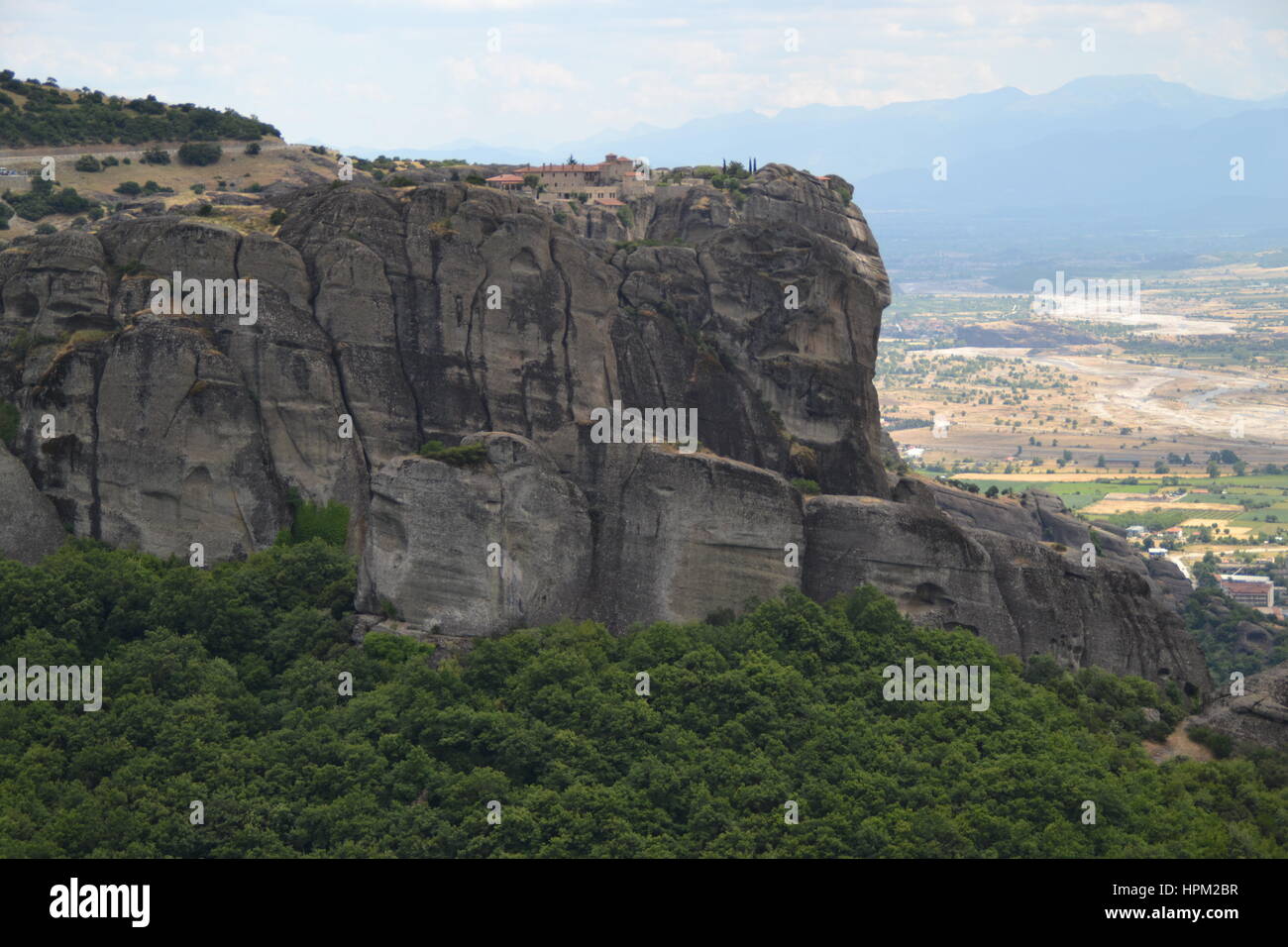 Meteora is formation of immense monolithic pillars and hills-like huge ...
