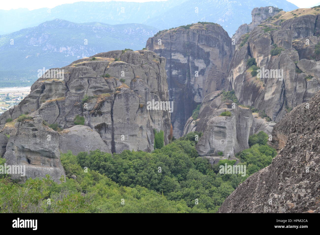 Meteora is formation of immense monolithic pillars and hills-like huge ...