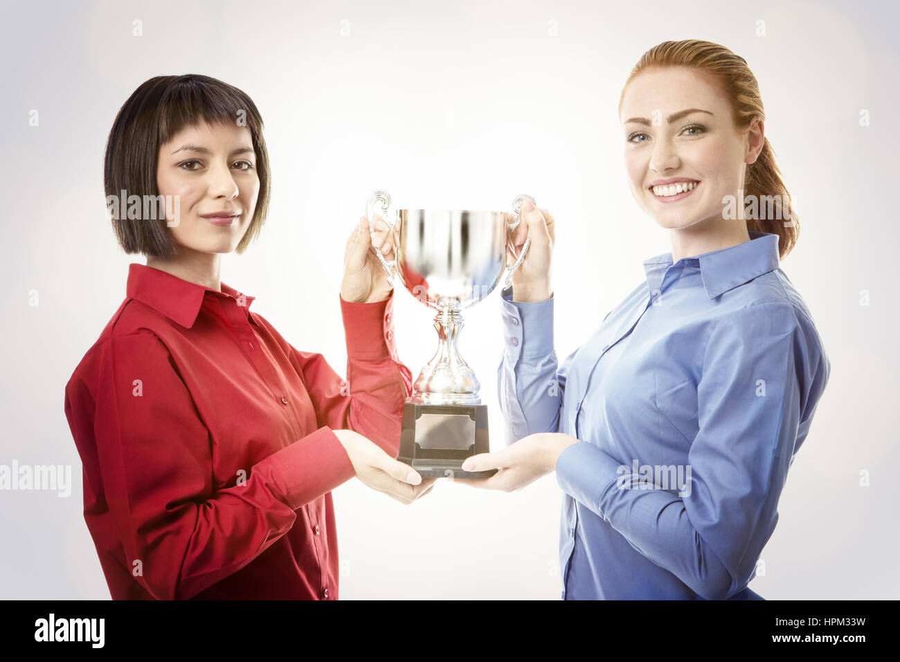 Woman holding up a trophy hi-res stock photography and images - Alamy Woman holding up a trophy hi-res stock photography and images - Alamy