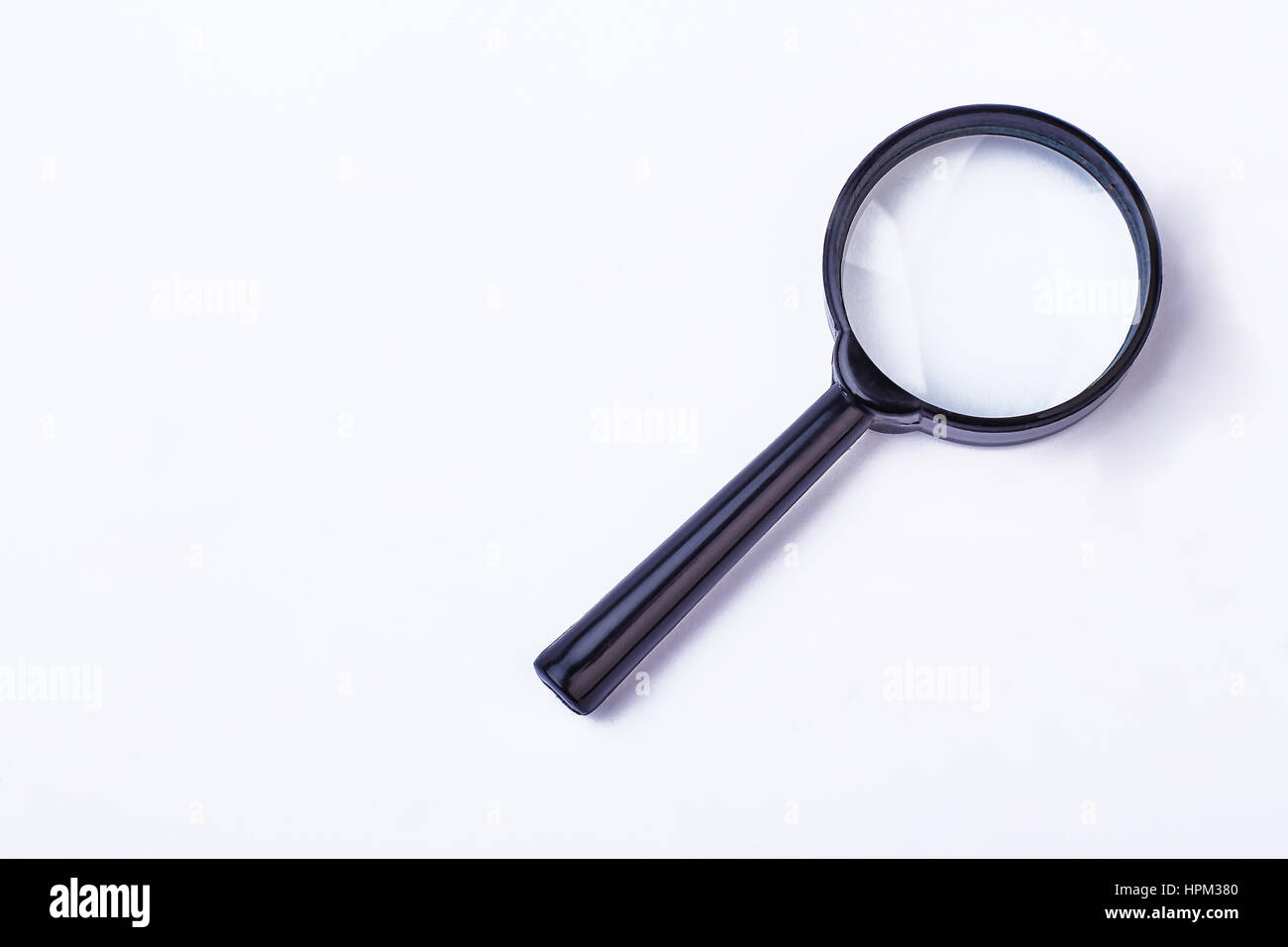 Magnifying glass in black frame Stock Photo - Alamy