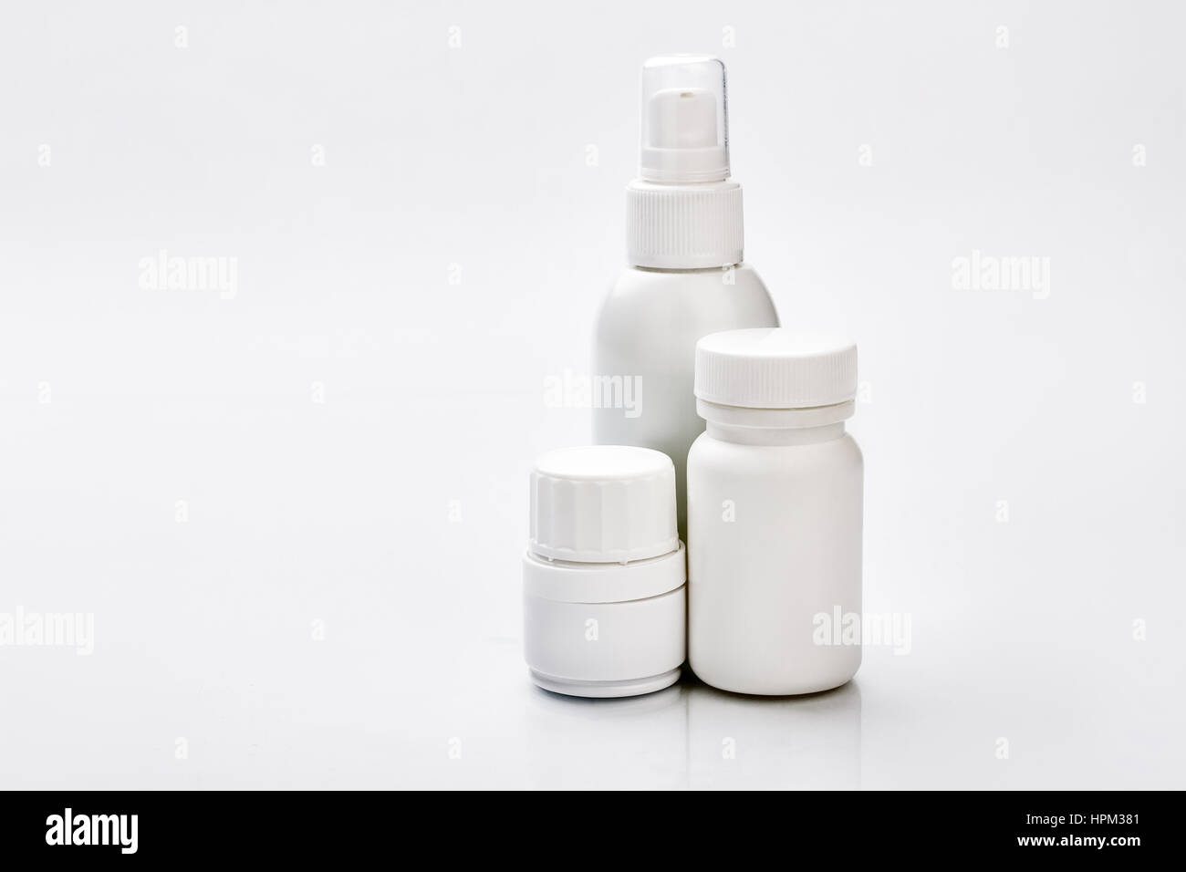 White plastic containers for pills Stock Photo - Alamy