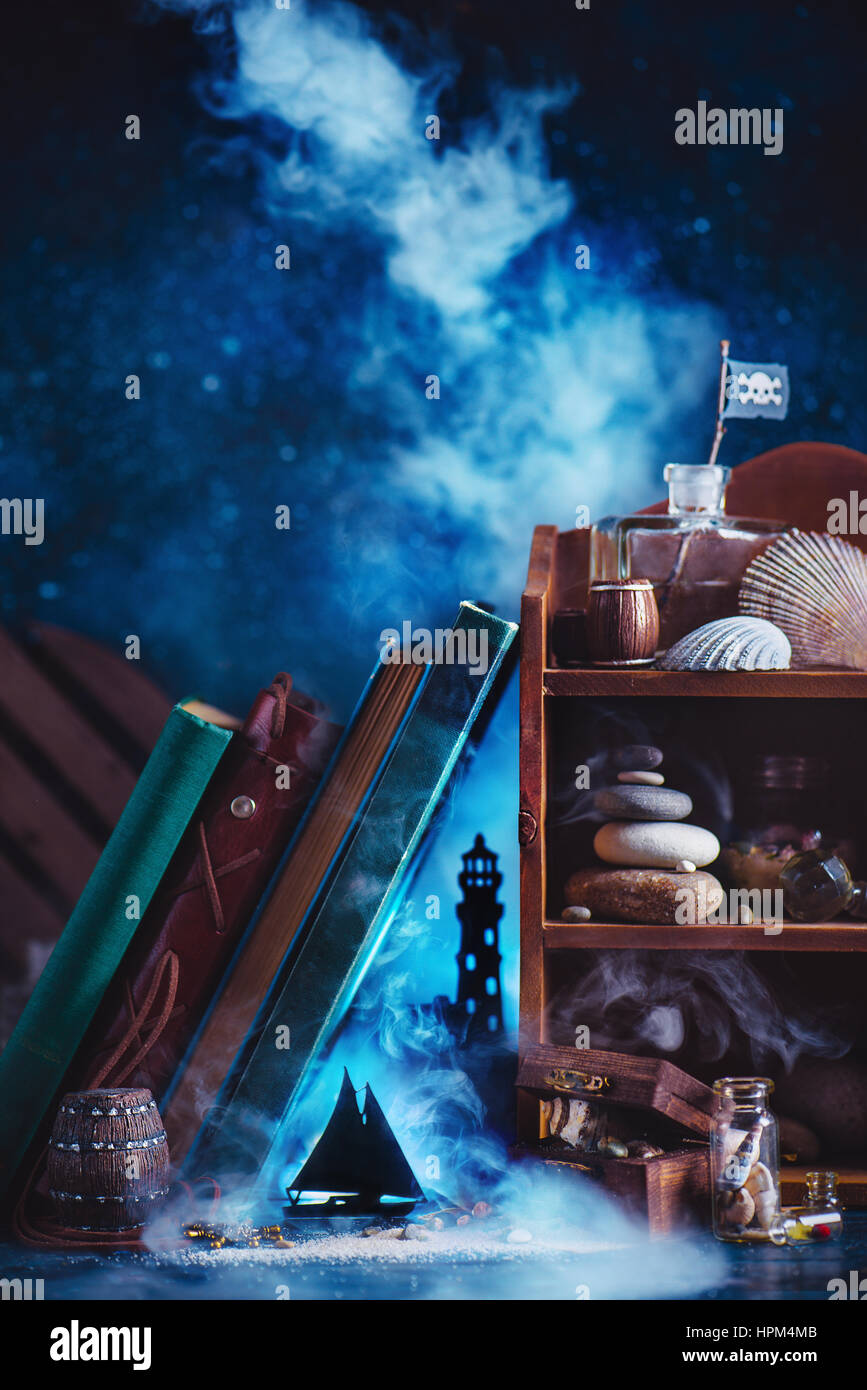 Marine still life with books, Jolly Roger sea shells, stones and paper ...