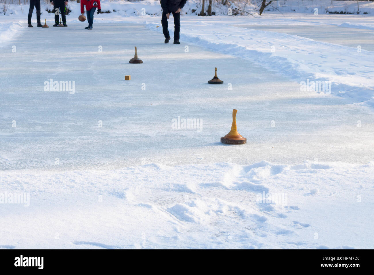 People playing curling on a frozen lake, Austria, Europe. winter sport ...