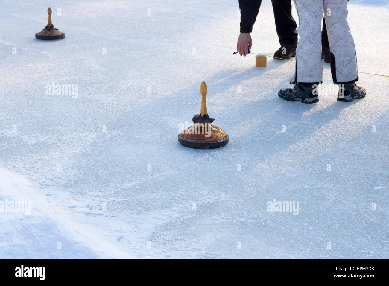 People playing curling on a frozen lake, Austria, Europe. winter sport ...