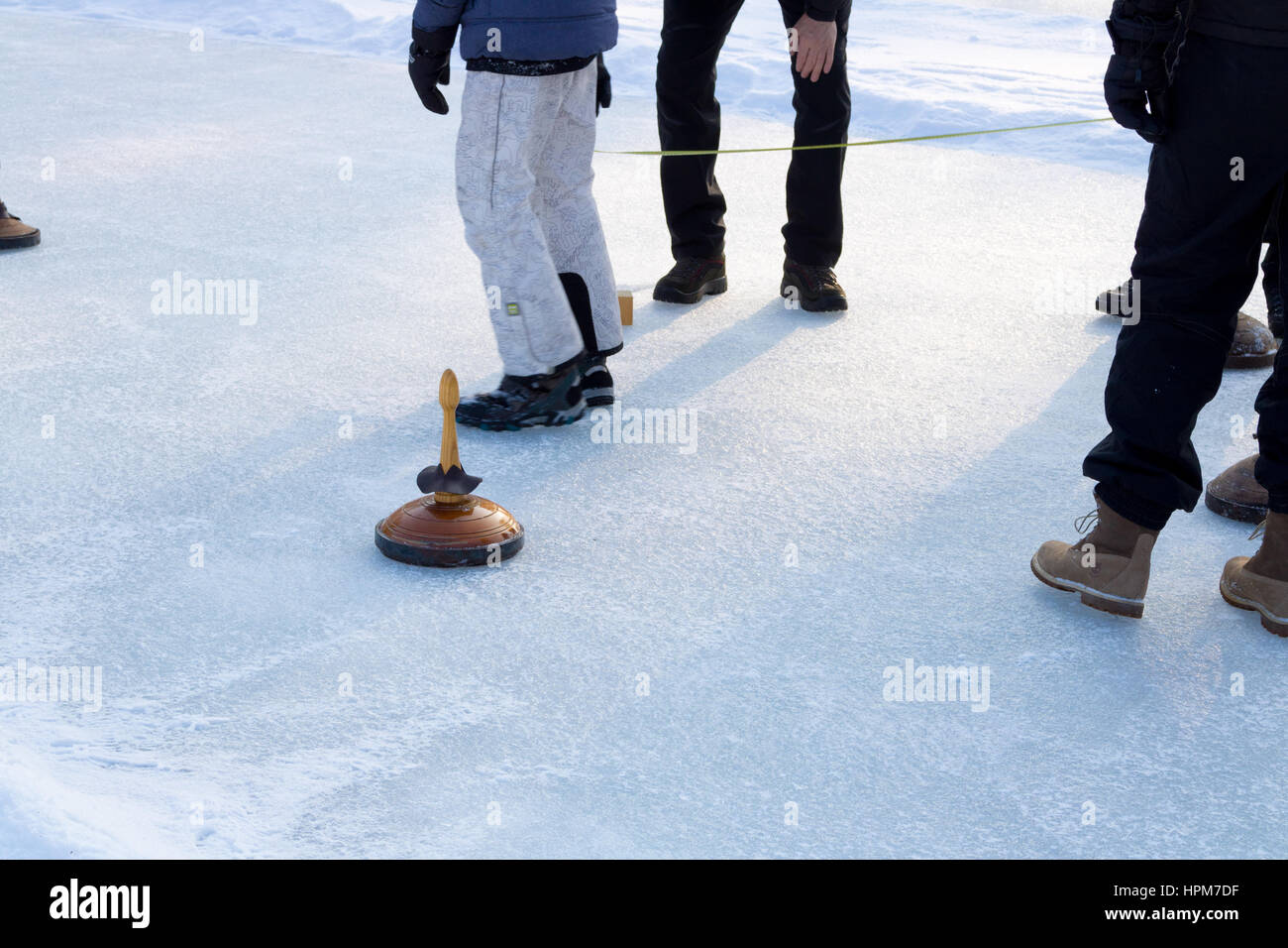People playing curling on a frozen lake, Austria, Europe. winter sport ...