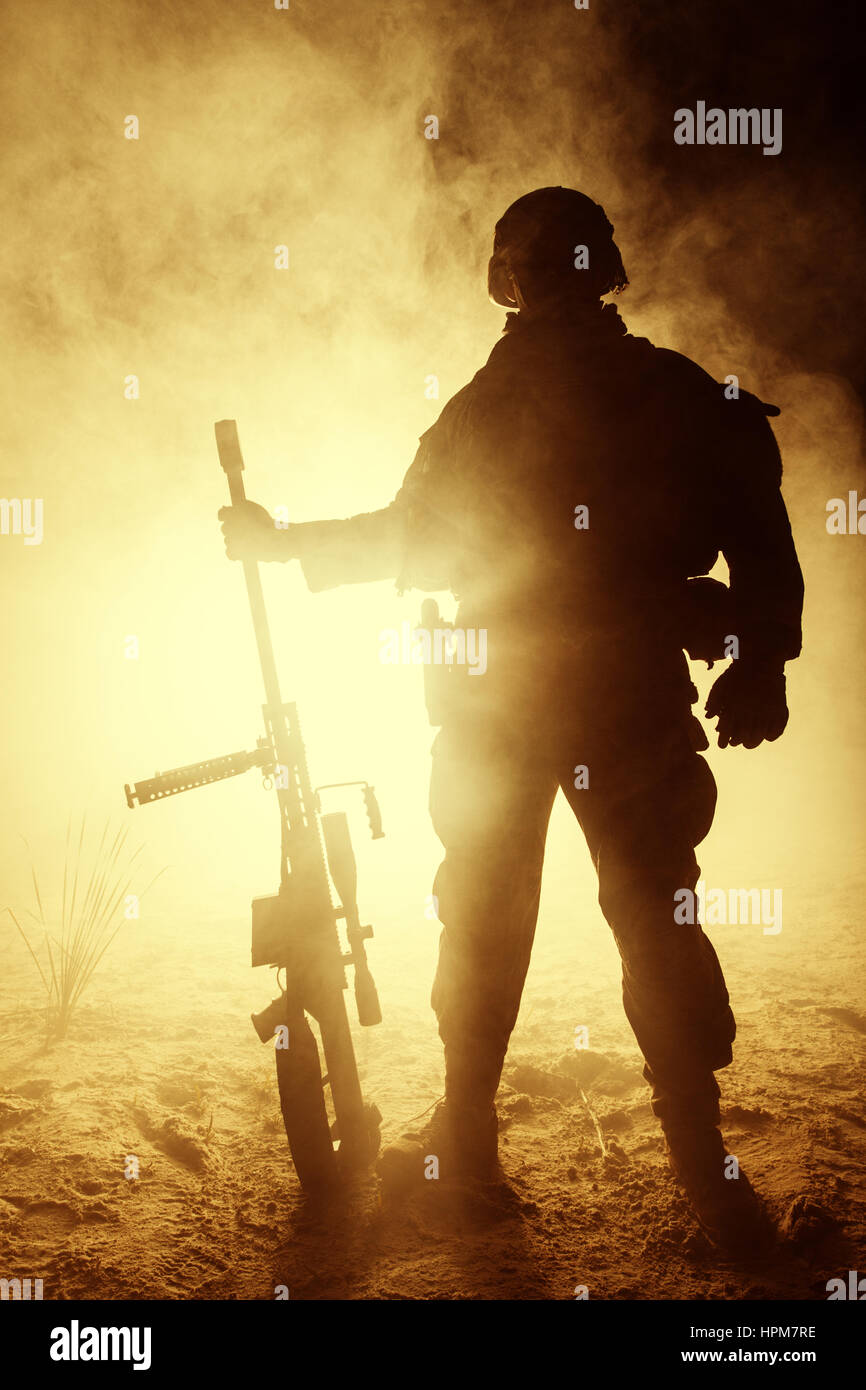 Army sniper in the fire and smoke Stock Photo - Alamy