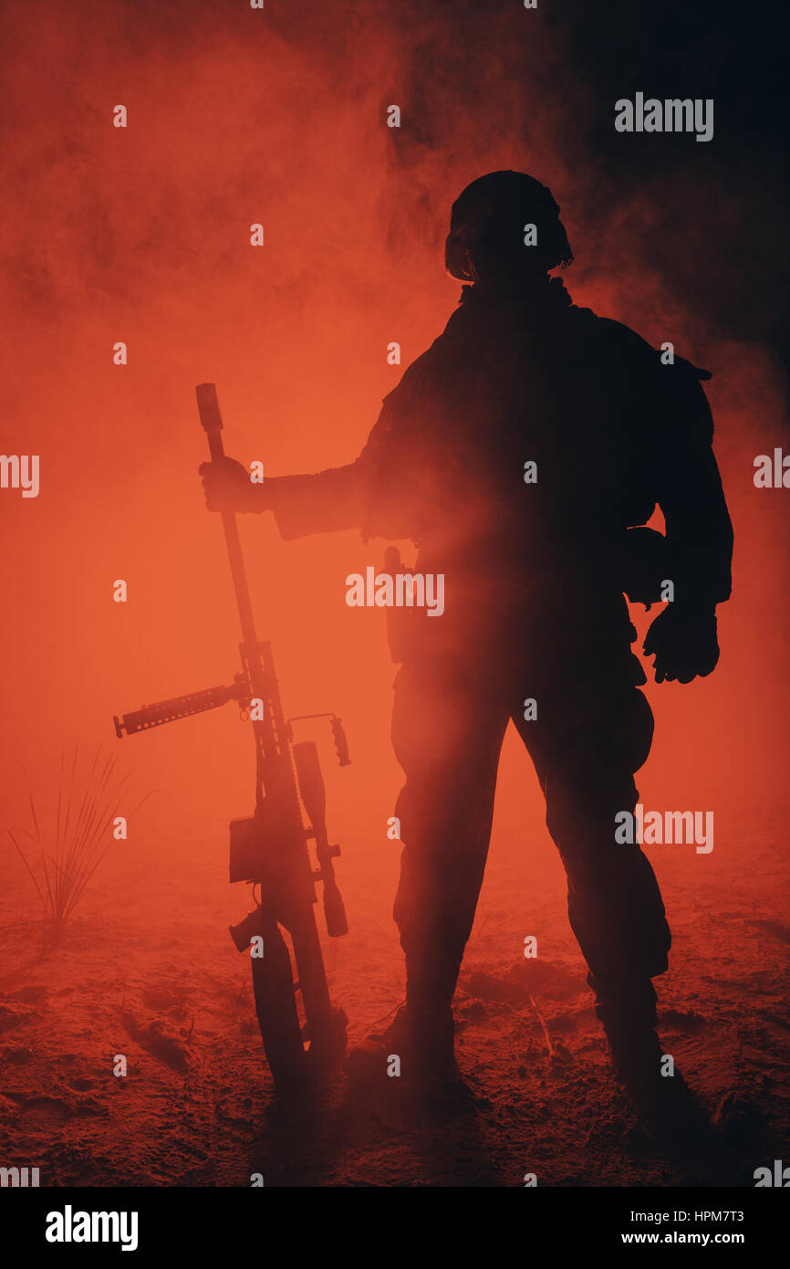 Army sniper in the fire and smoke Stock Photo - Alamy