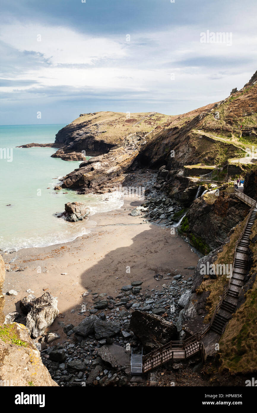 View over Tintagel caves and the steps going down to the beach ...