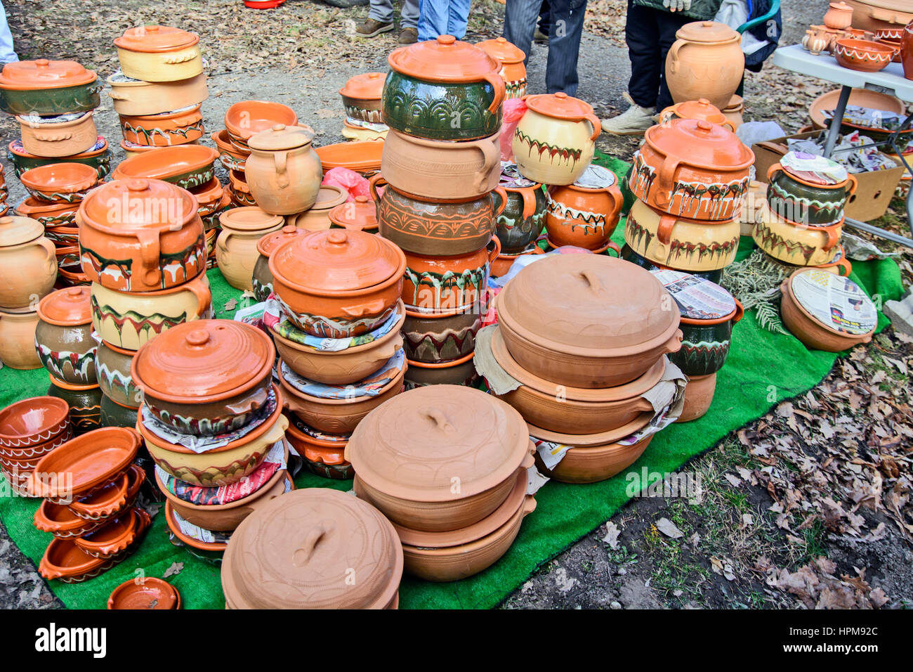 Earthy pots exposed for sale on the opening area Stock Photo - Alamy