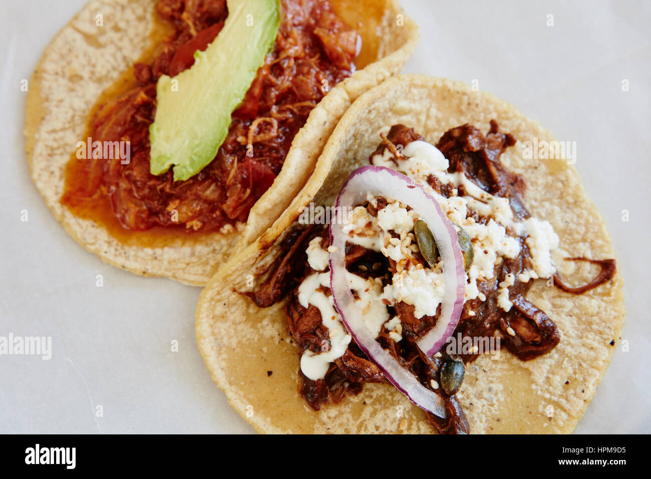 Mole Poblano (Chicken cooked in savory chocolate sauce topped with sour ...