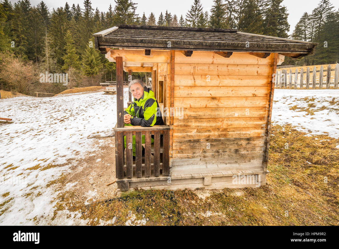 mature man in small snowy hut in mountains Stock Photo - Alamy
