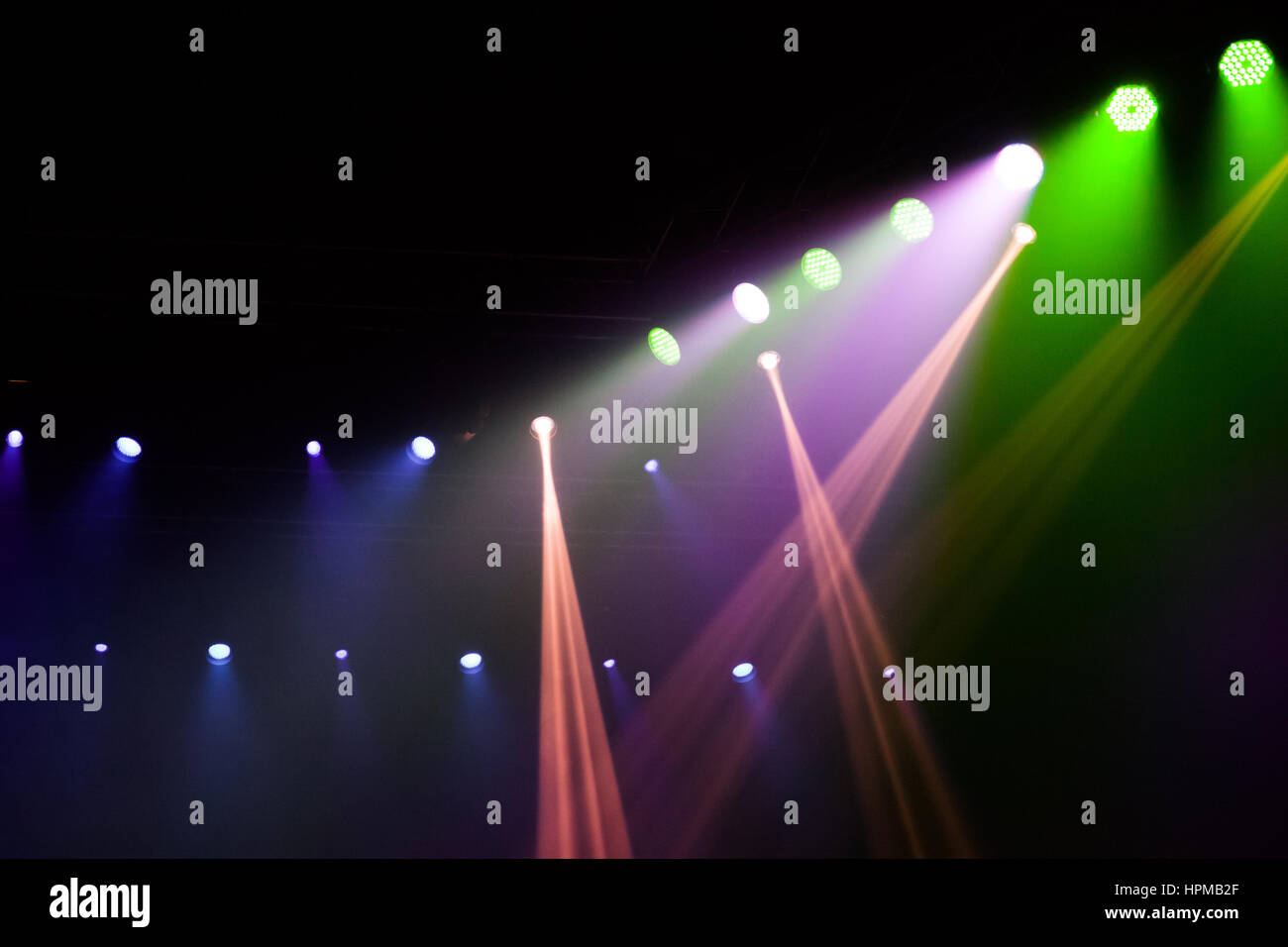 Stage lights on concert. Lighting equipment with multi-colored beams ...