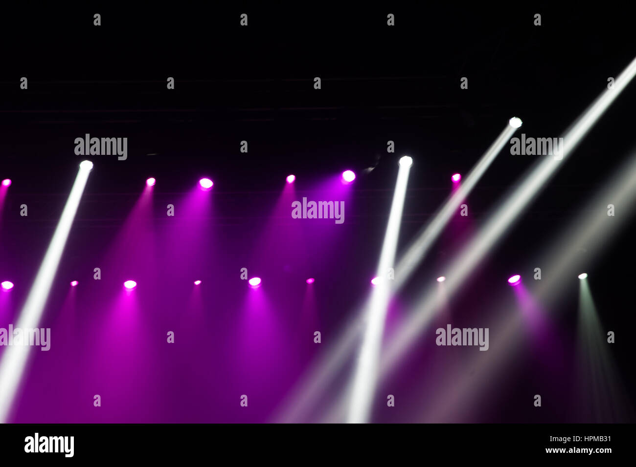 Stage lights on concert. Lighting equipment with multi-colored beams ...