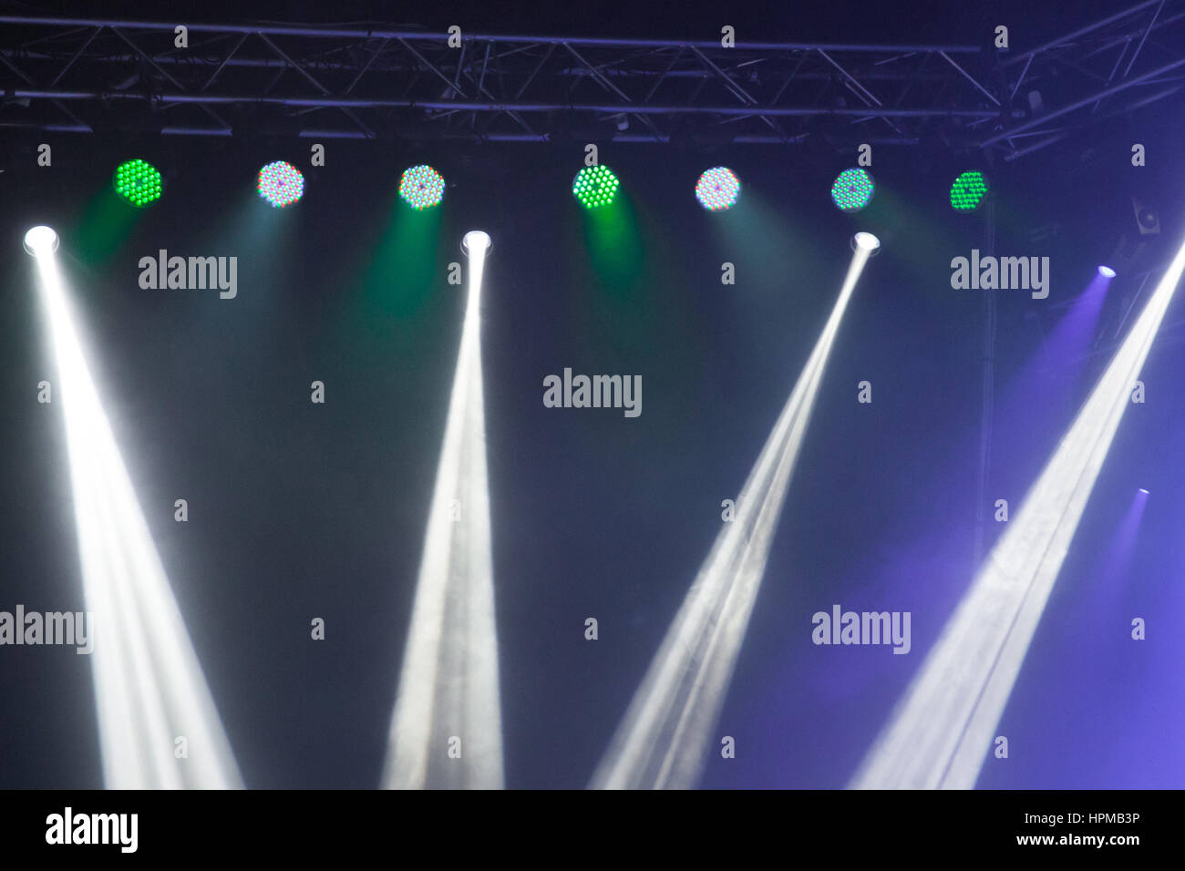 Stage lights on concert. Lighting equipment with multicolored beams ...