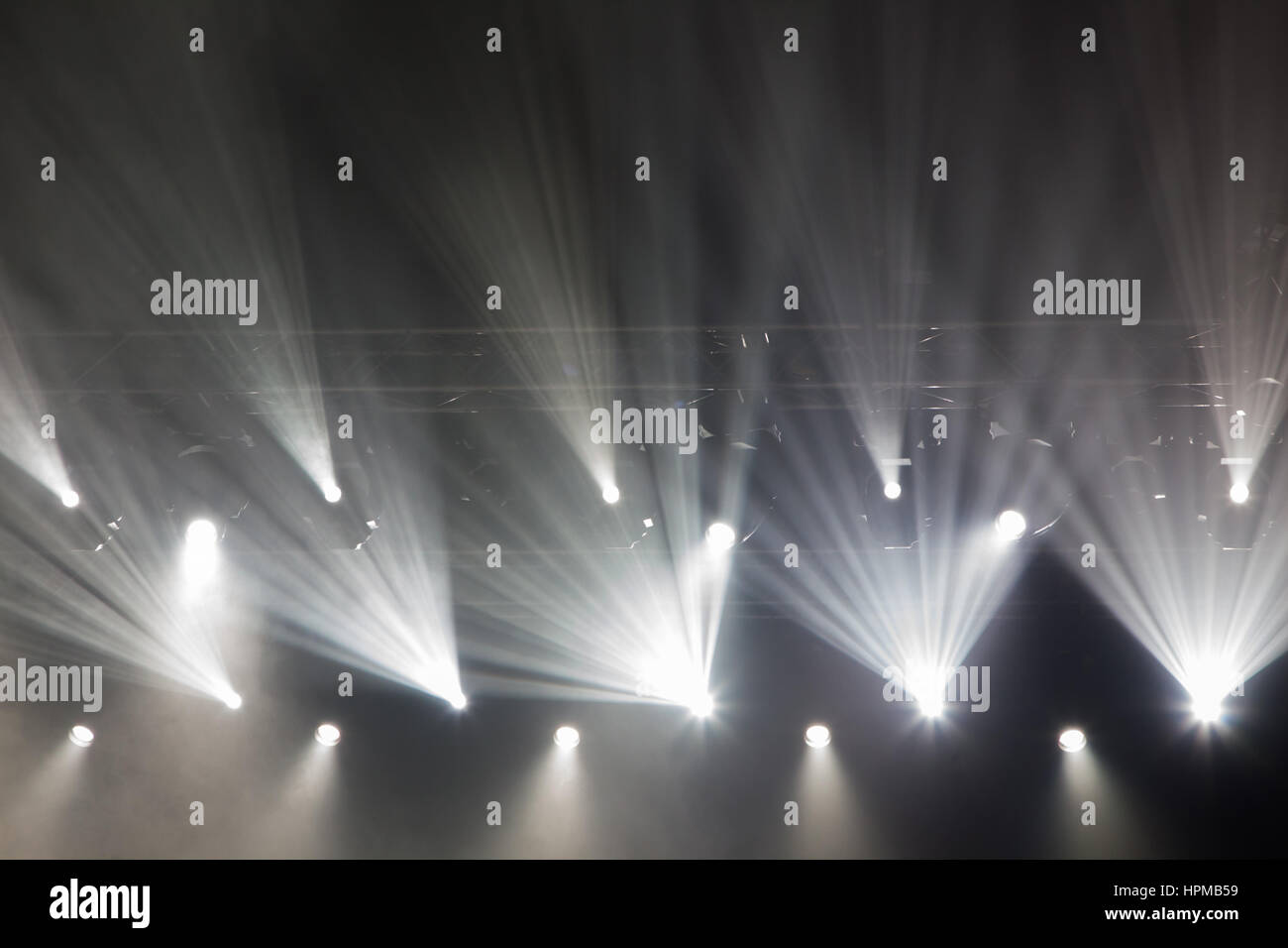 Stage lights on concert. Lighting equipment with multicolored beams ...