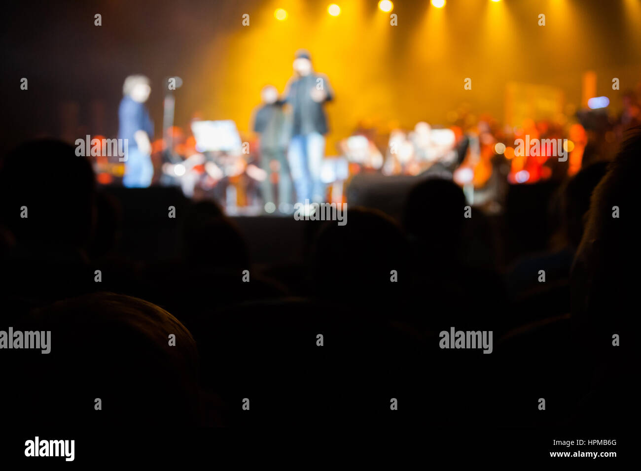 The audience at a concert on background of scene Stock Photo - Alamy