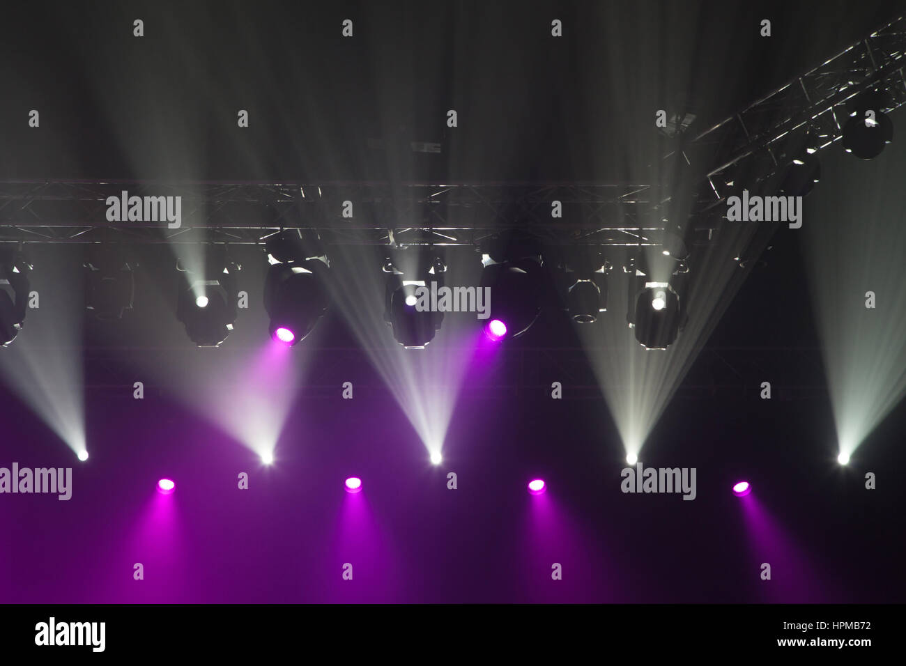 Stage lights on concert. Lighting equipment with multicolored beams ...