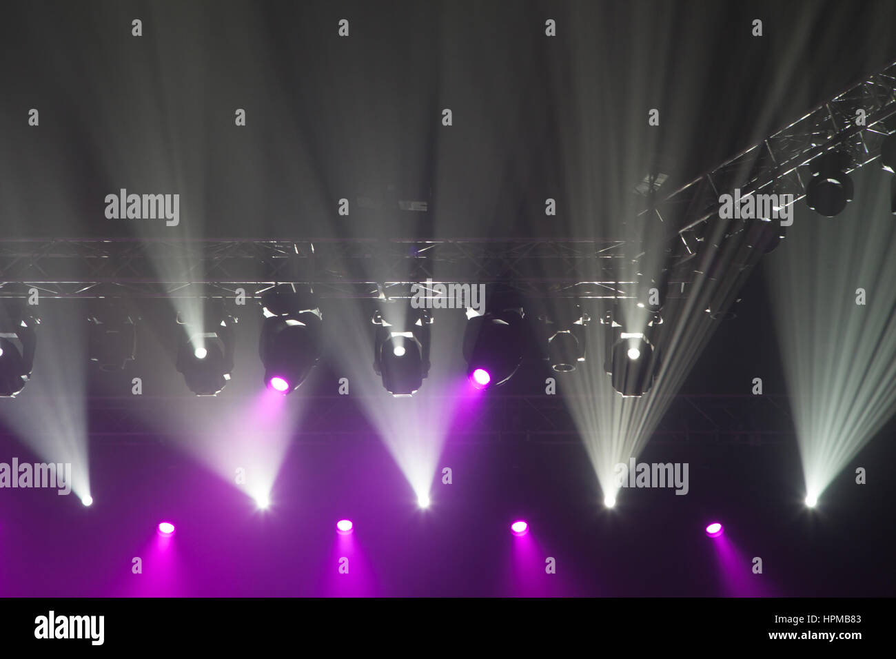 Stage lights on concert. Lighting equipment with multicolored beams ...