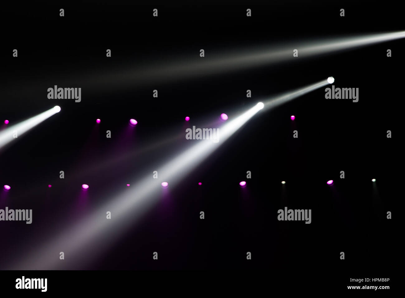 Stage lights on concert. Lighting equipment with multicolored beams ...