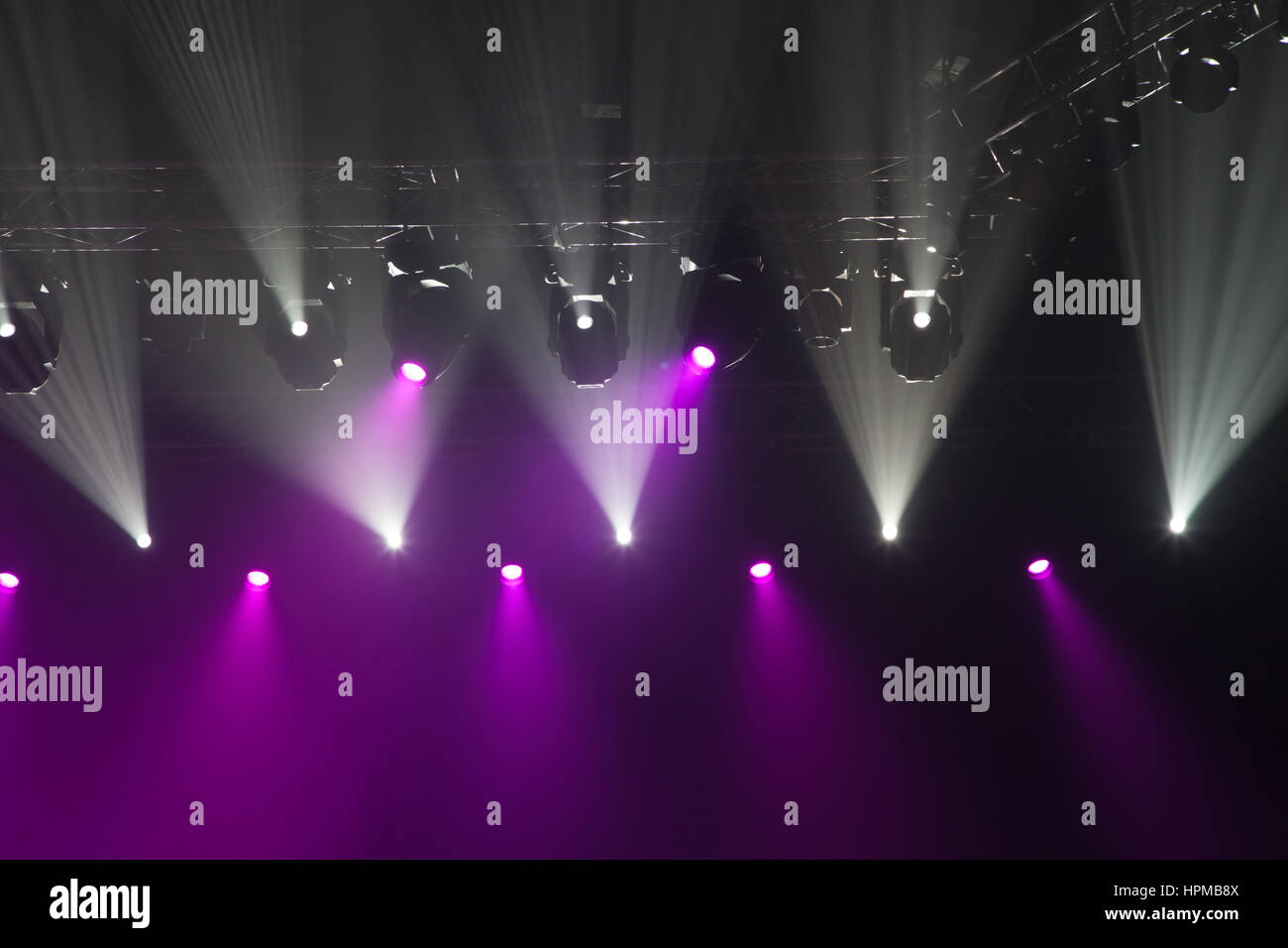 Stage lights on concert. Lighting equipment with multicolored beams ...