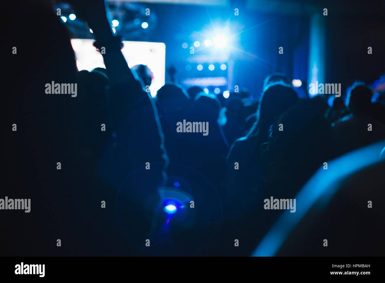 The spectators at the concert listening to the music and applauding ...