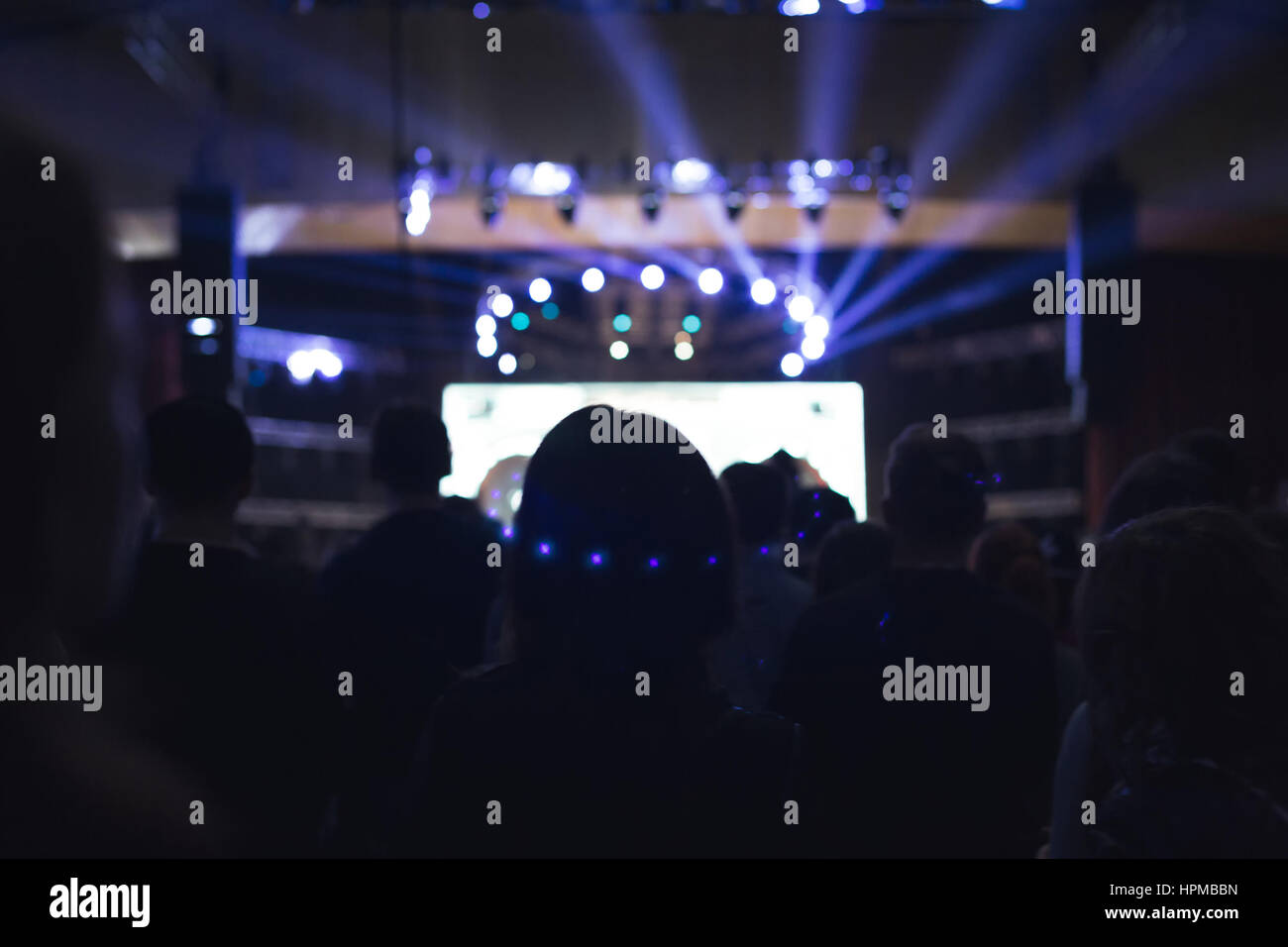 The audience watching the concert on stage Stock Photo - Alamy