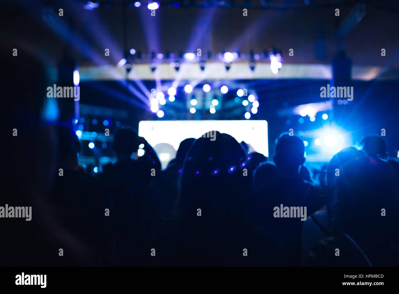 The audience watching the concert on stage Stock Photo - Alamy