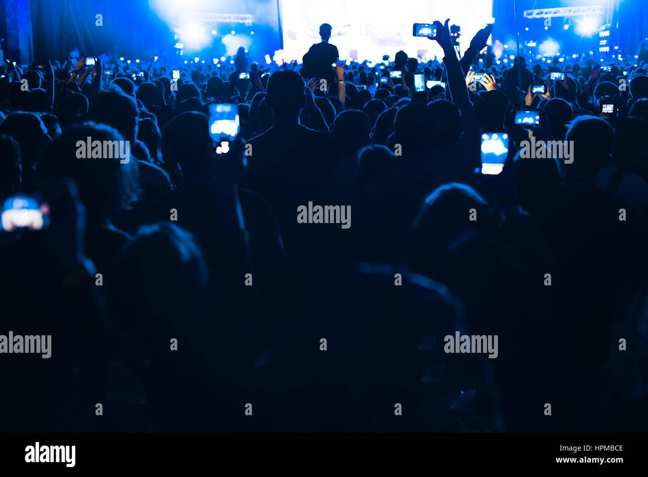 The spectators at the concert listening to the music Stock Photo - Alamy
