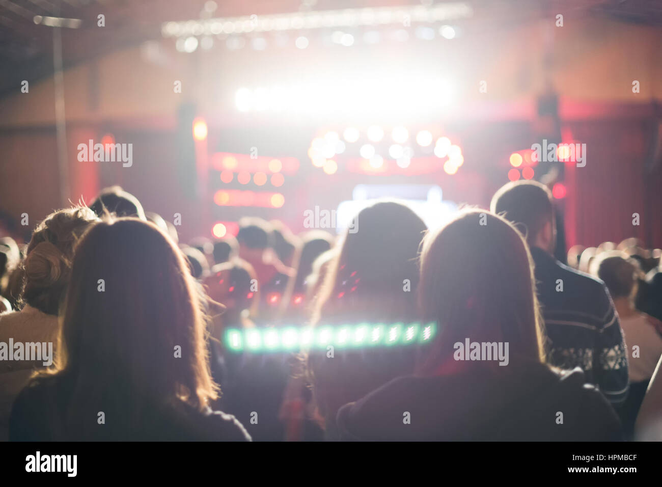 The audience watching the concert on stage Stock Photo - Alamy