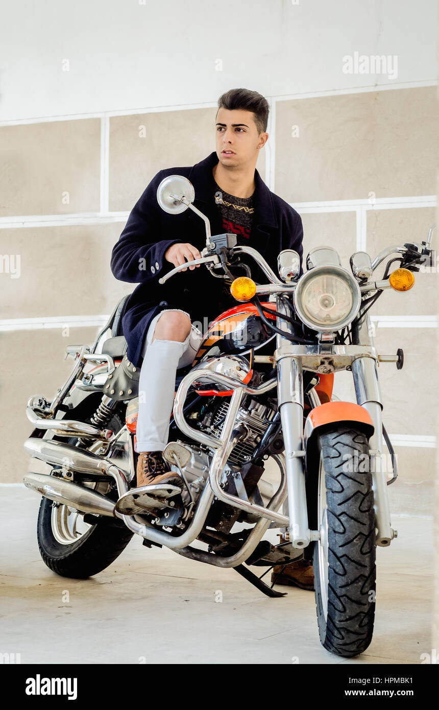 Handsome fashion man sitting on classical motorcycle Stock Photo - Alamy
