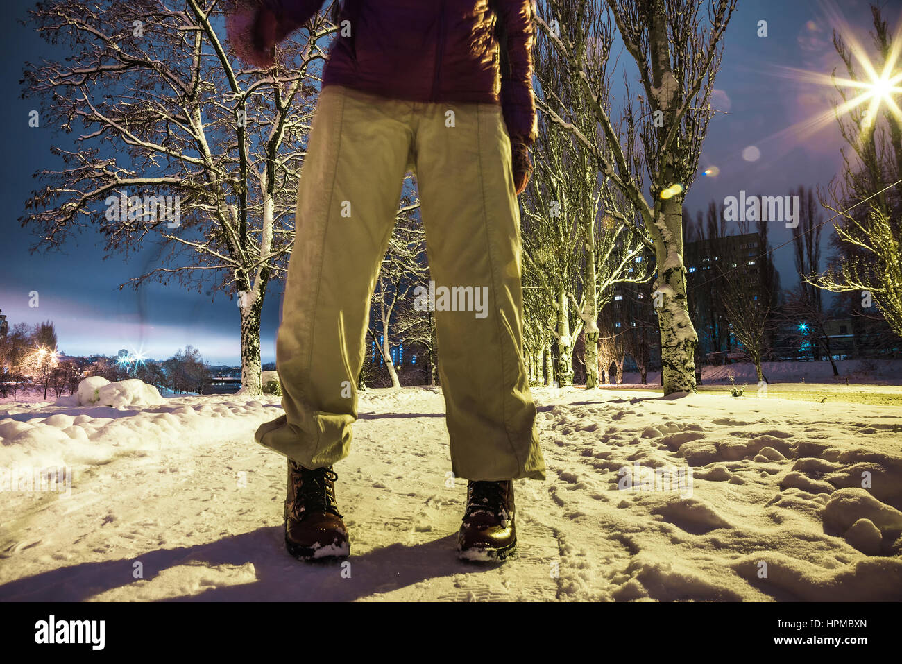 Human feet standing snowy road night street lamps Stock Photo - Alamy