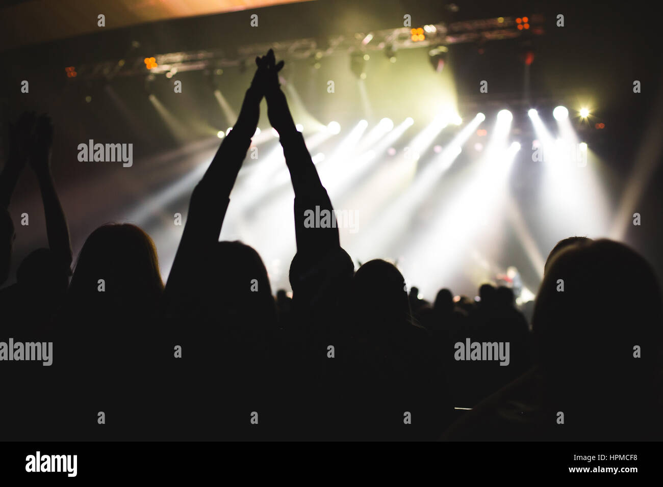 The audience applauded by the stage artist. They shines the spotlight ...
