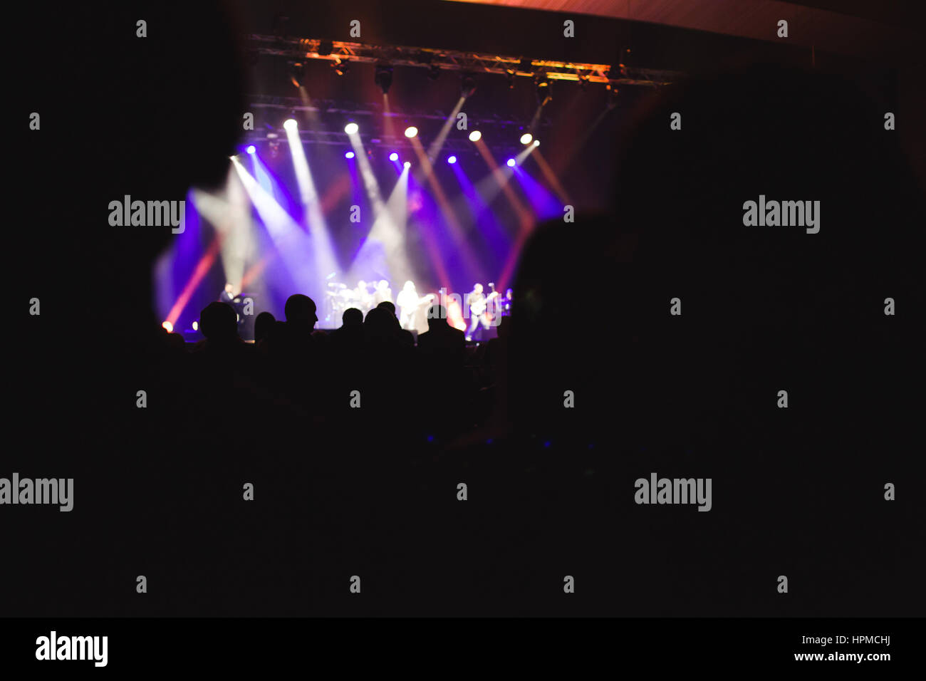 The audience watching the concert on stage Stock Photo - Alamy