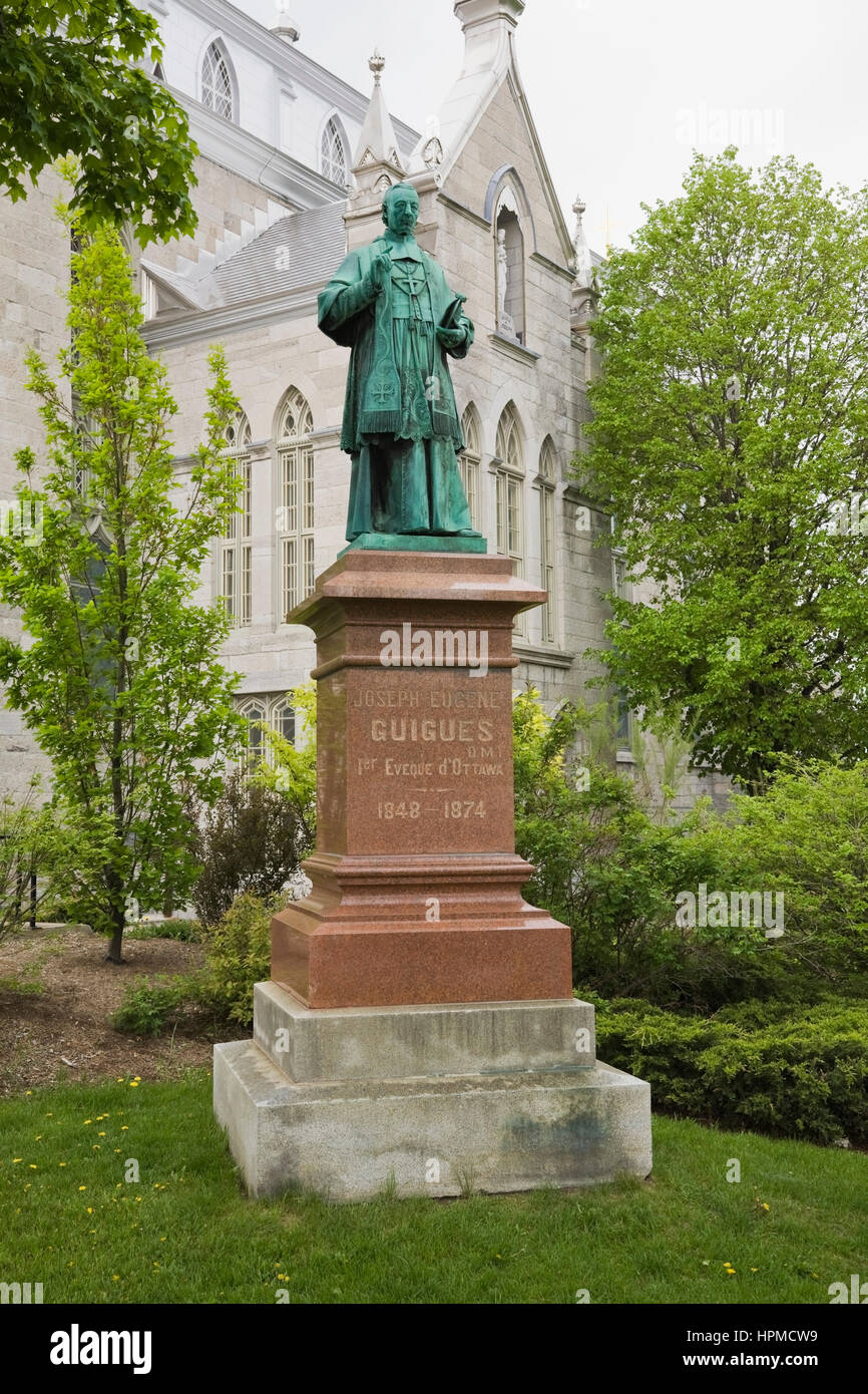 Joseph-Eugene Guigues monument on front lawn of Notre-Dame Basilica at ...